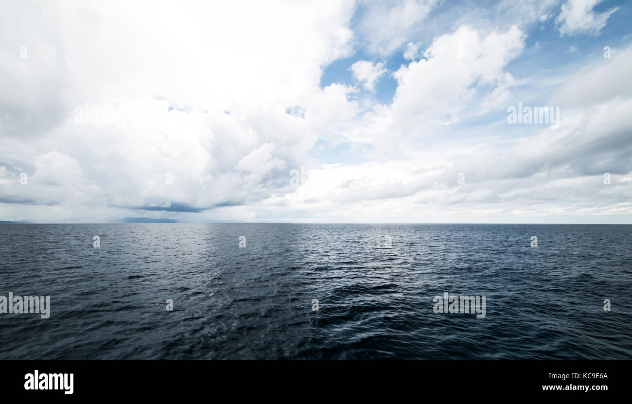 Dark clouds in open ocean Stock Photo - Alamy