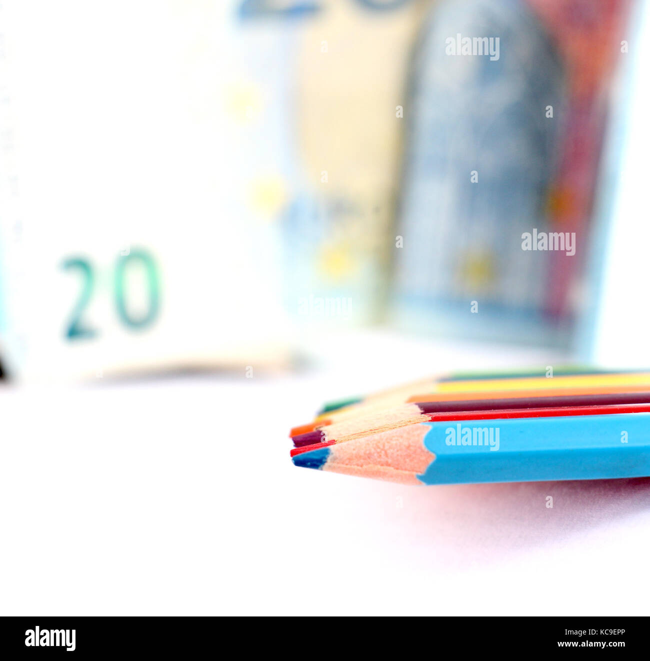 Color pencils and euro banknote on white background, shallow dof Stock ...