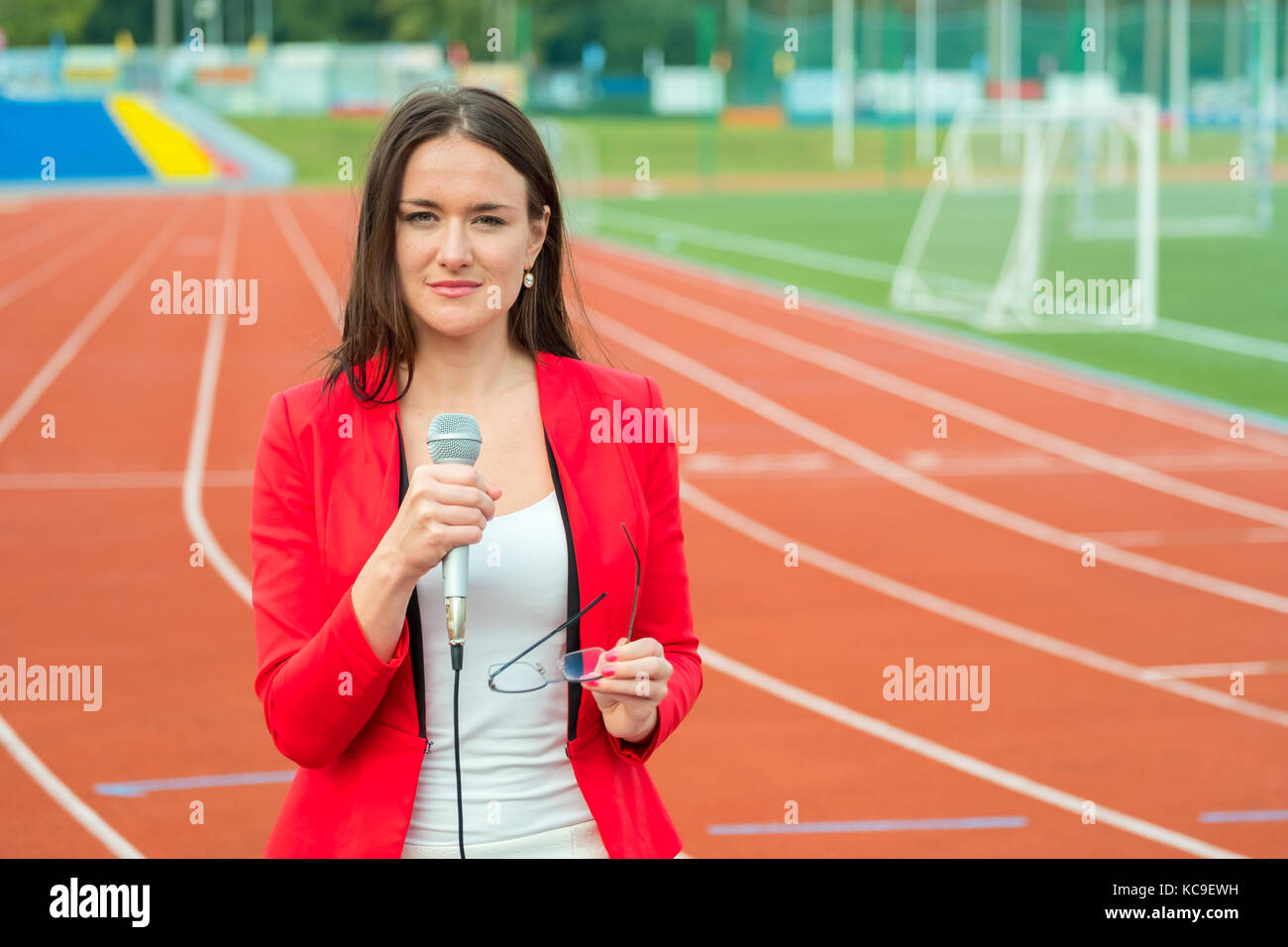 Young girl TV reporter is broadcasting Stock Photo - Alamy