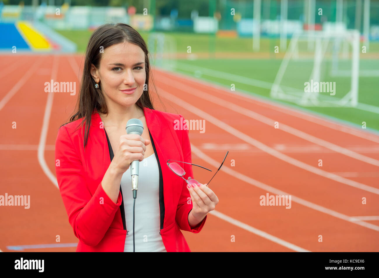 Young girl TV reporter is broadcasting Stock Photo - Alamy