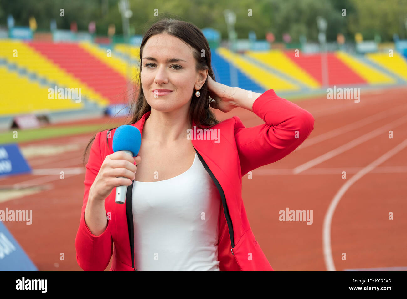 Young girl TV reporter is broadcasting Stock Photo - Alamy