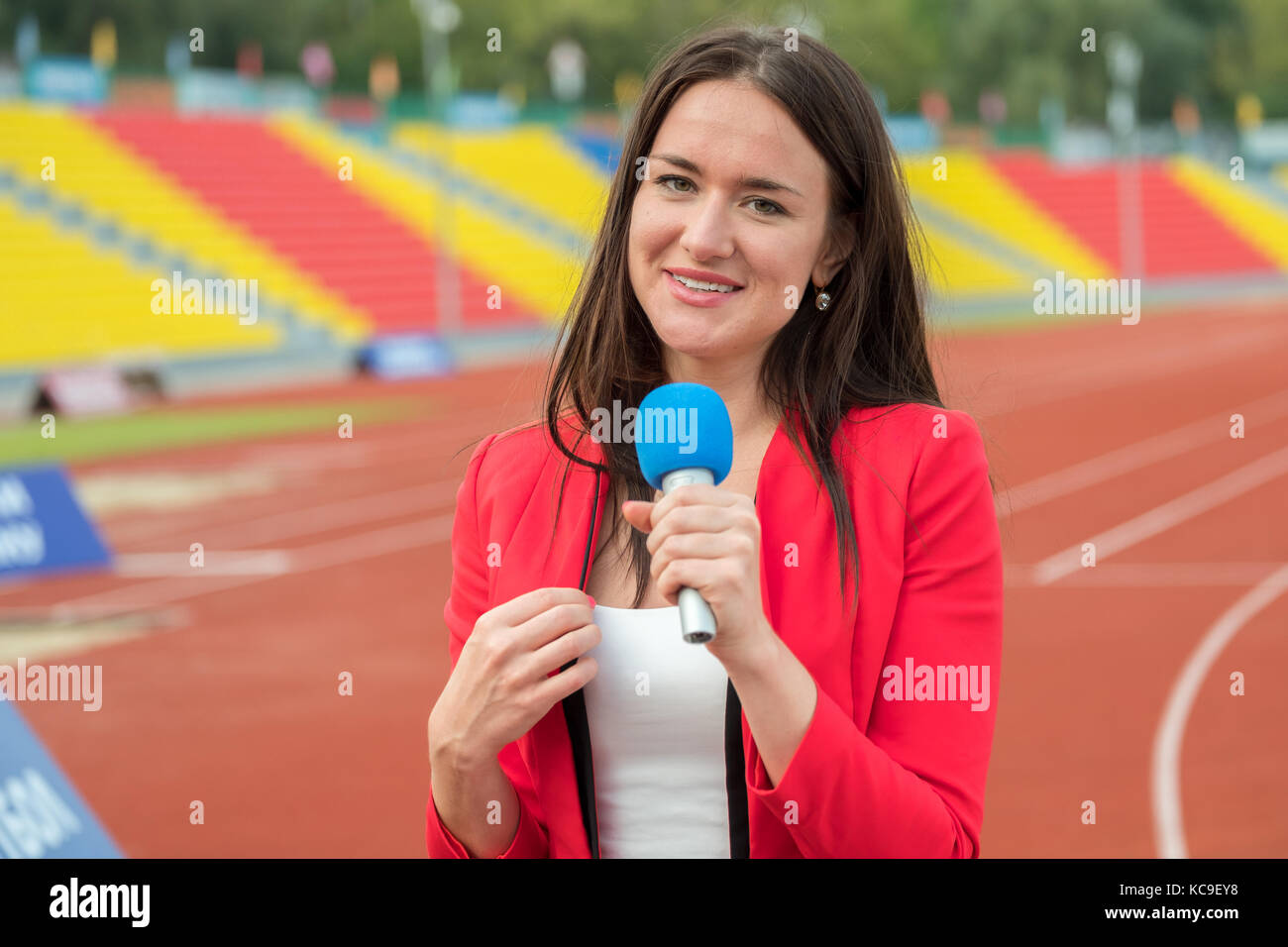 Young girl TV reporter is broadcasting Stock Photo - Alamy
