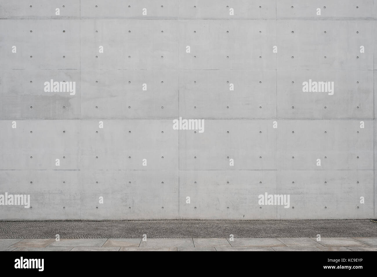 walkway / sidewalk and exposed concrete wall background Stock Photo - Alamy