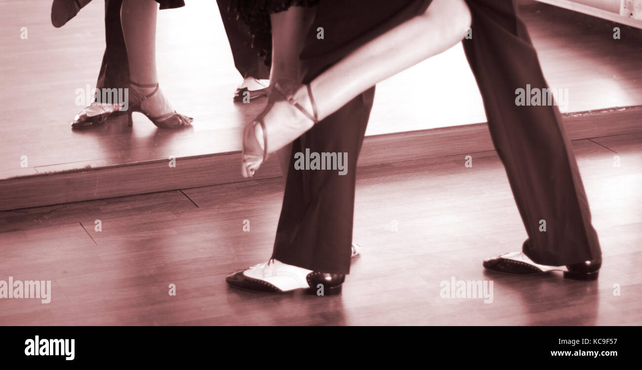 Ballroom dance couple of dancers and teachers in studio school dancing ...