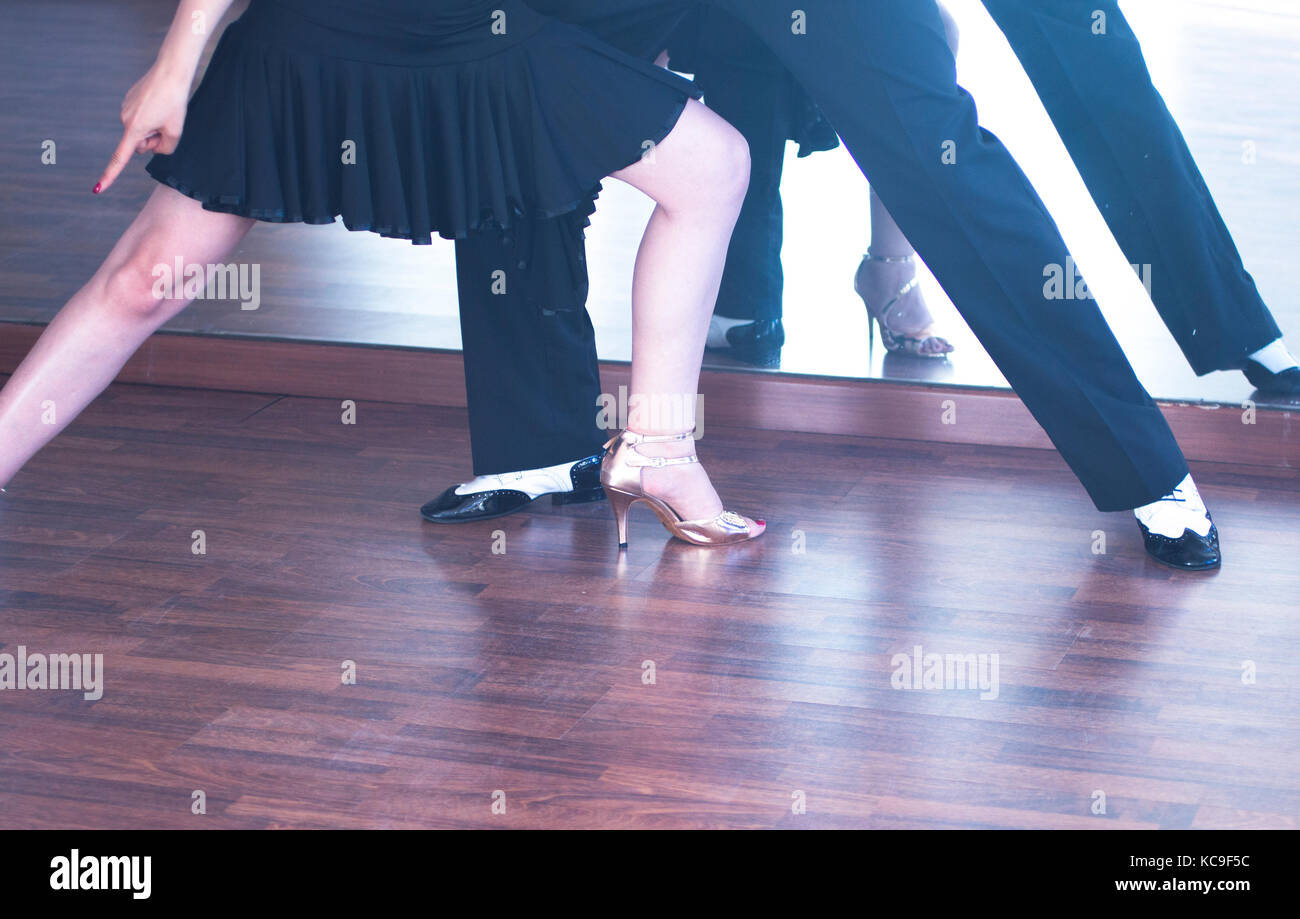 Ballroom dance couple of dancers and teachers in studio school dancing ...