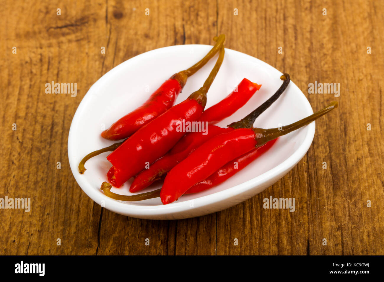 Pickled chili peppers Stock Photo - Alamy