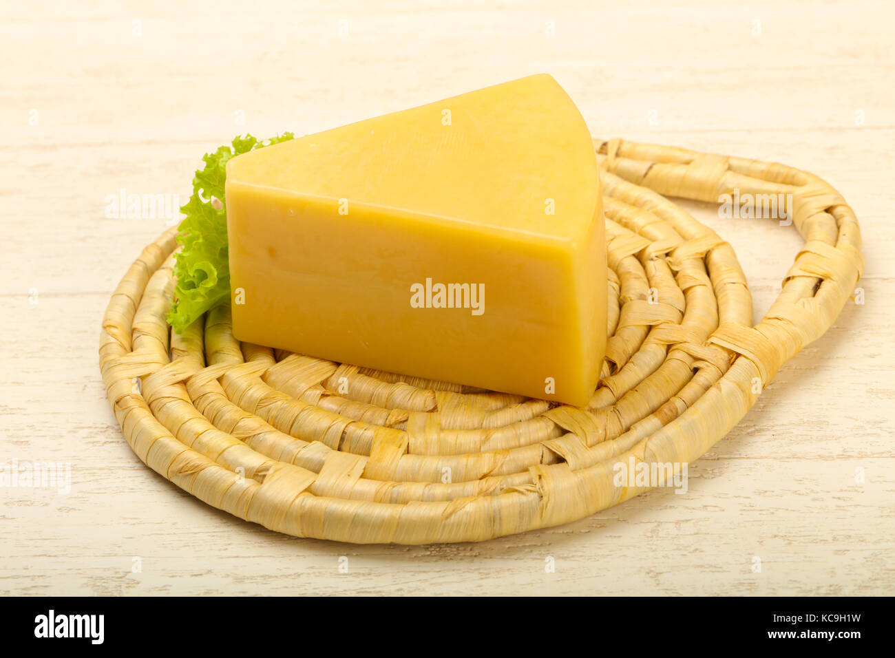 Parmesan cheese triangle Stock Photo - Alamy