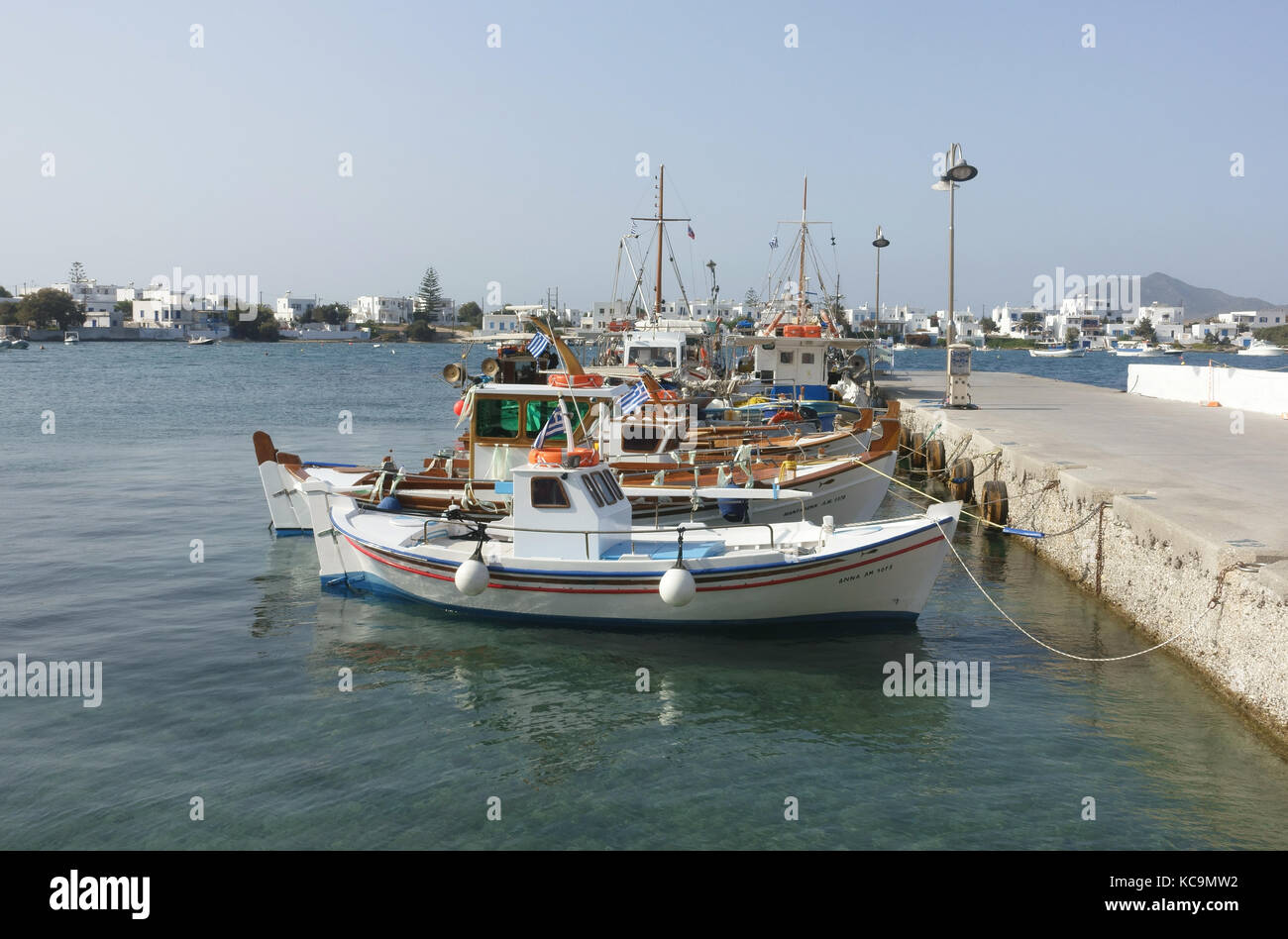 fishing boats moored to the jetty Stock Photo - Alamy