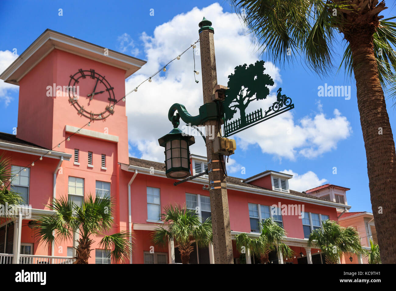Lamp post with the iconic symbol of a child on a bike and the pet dog ...