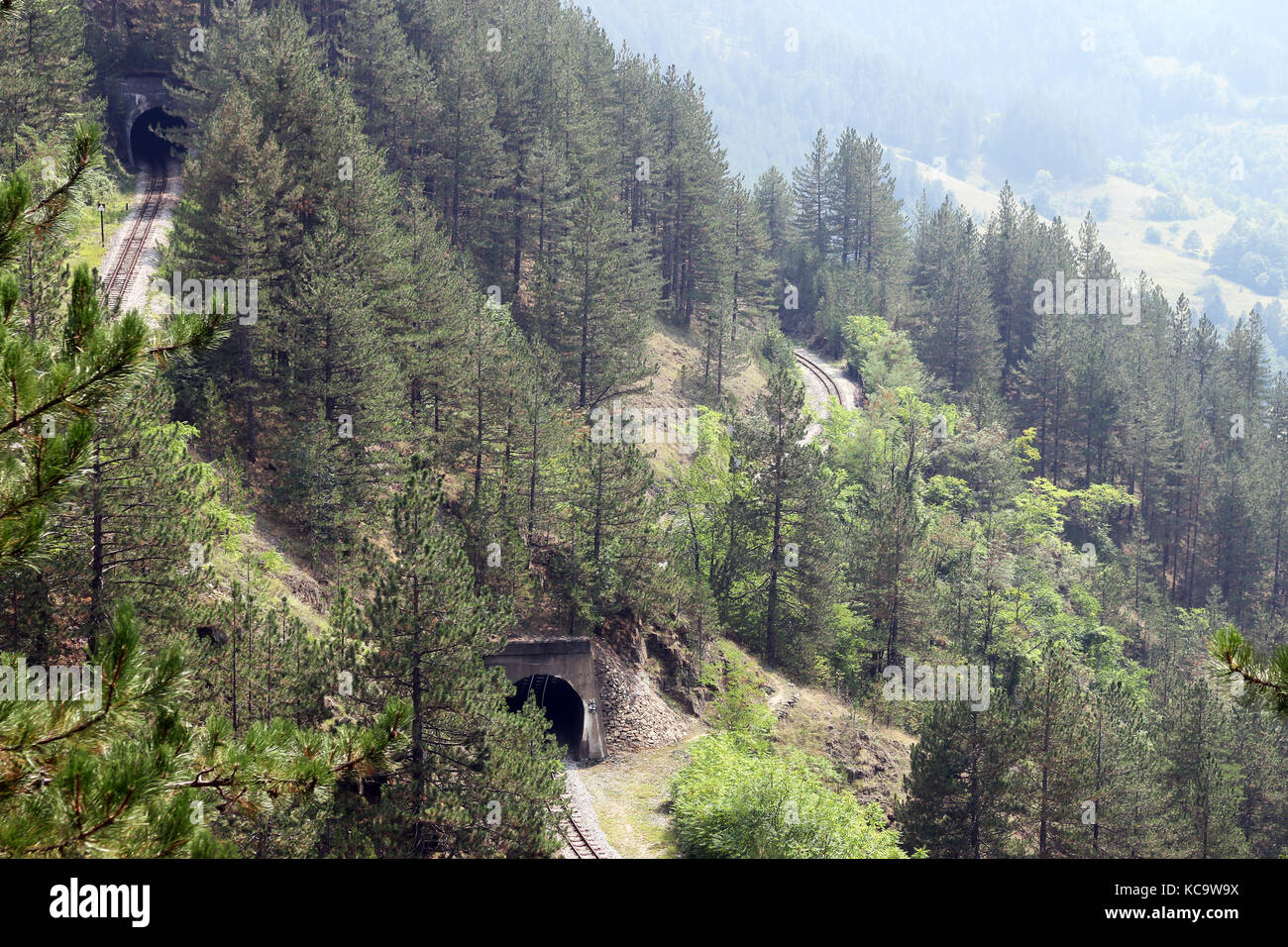 Mountains with railroad and tunnels Stock Photo - Alamy