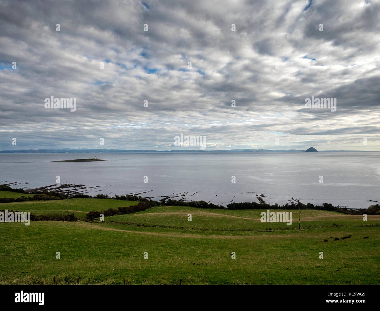 Pladda (left) and Ailsa Craig, small islands in the Firth of Clyde off ...