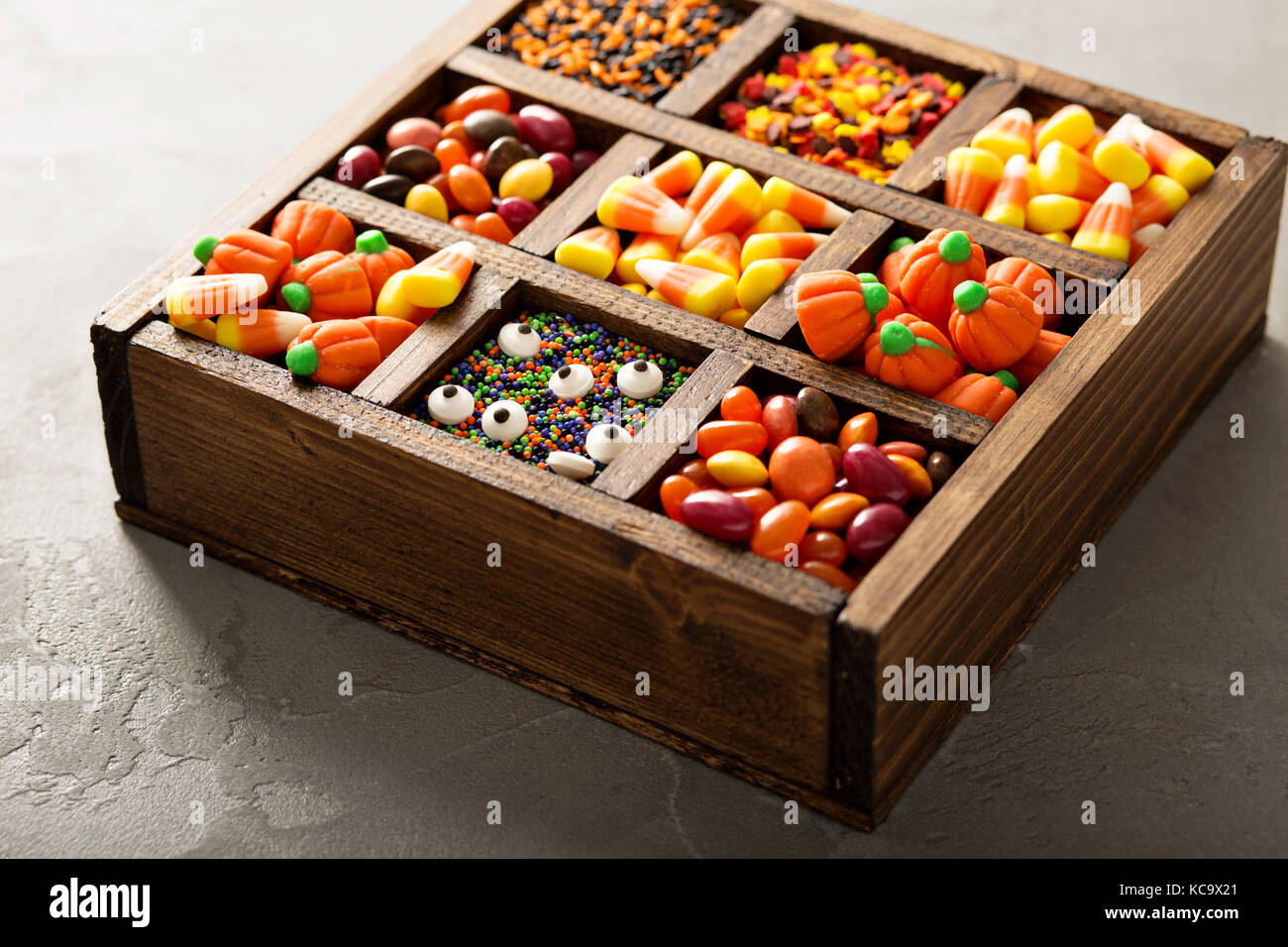 Halloween candy in a wooden box Stock Photo - Alamy