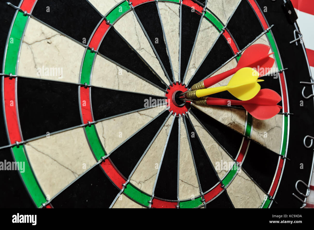 Three darts arrows in the target center in bull's eye. Business goal ...