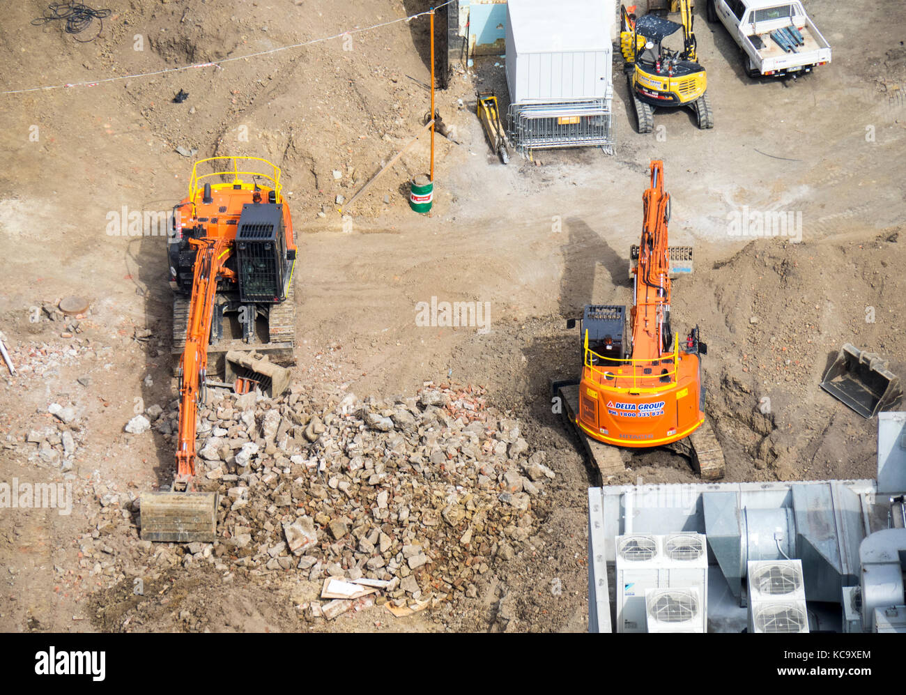 Hydraulic excavators clearing rubble on a construction work site Stock ...