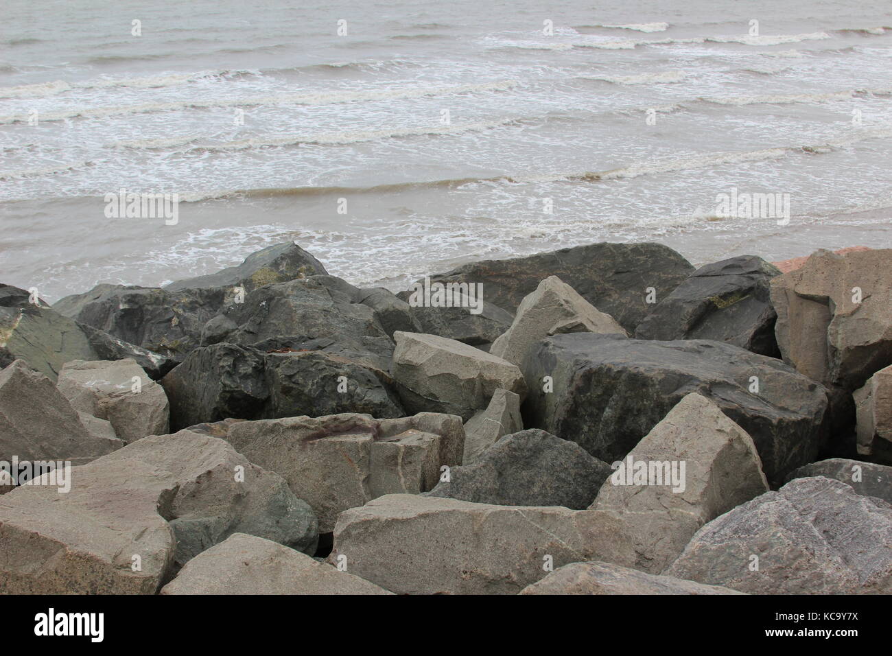 Penmaenmaer beach on a grey windy day Stock Photo - Alamy