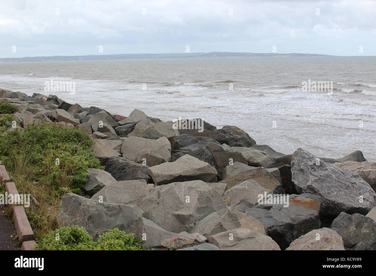 Penmaenmaer beach on a grey windy day Stock Photo - Alamy