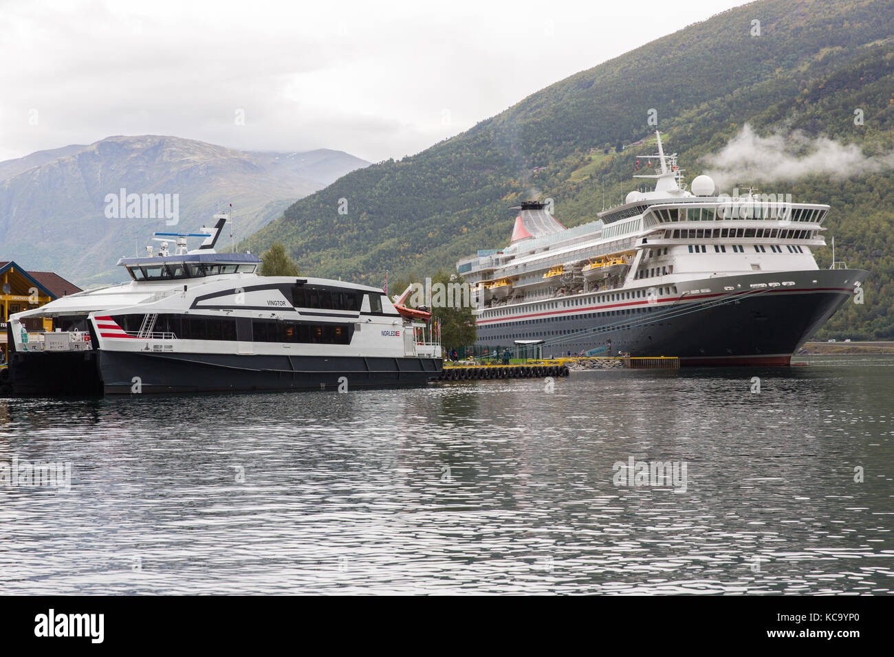 The MS Balmoral, A Fred Olsen Cruise Ship next to a local ferry in a ...