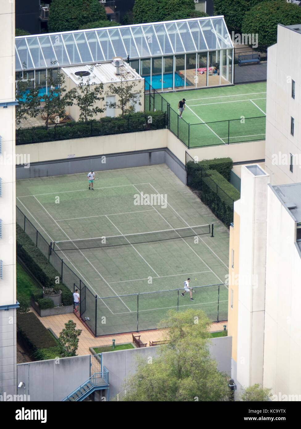 Two tennis courts located in high rise housing developments in central ...