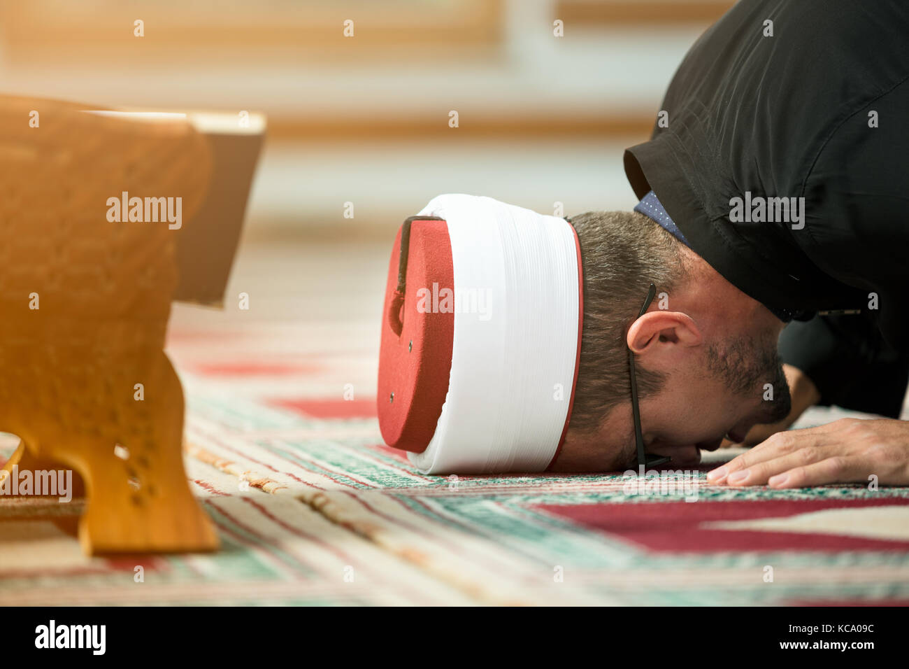 Young Imam praying inside of beautiful mosque Stock Photo - Alamy