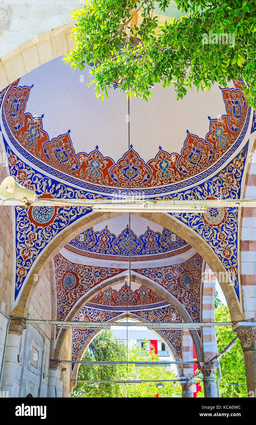 The domes of the porch of Muratpasa mosque are decorated with colorful ...