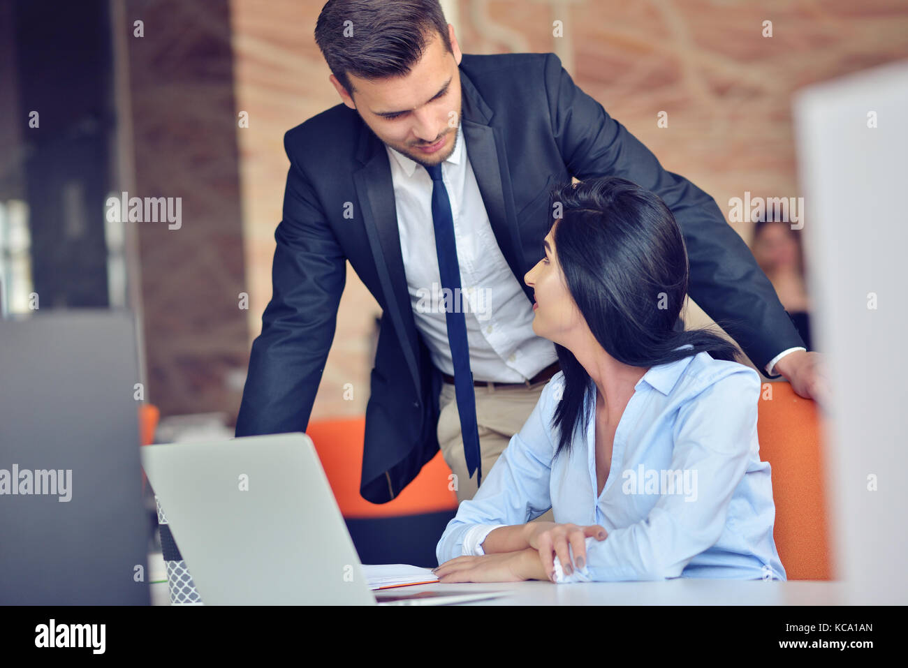business couple in an office working on the computer Stock Photo - Alamy