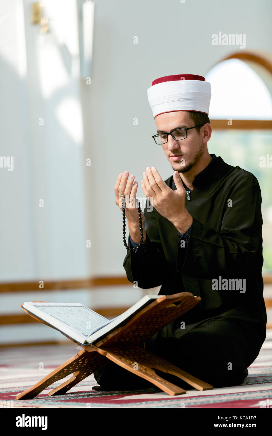 Religious muslim man praying inside the mosque Stock Photo - Alamy