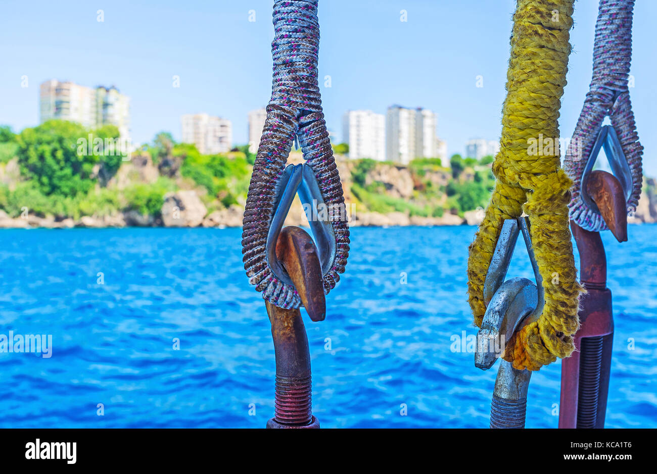 The rusty hooks and dusty ropes of the tourist yacht, sailing along the ...