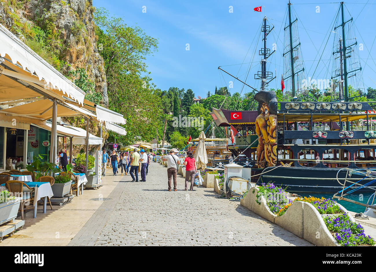 ANTALYA, TURKEY - MAY 12, 2017: The tourists walk along the promenade ...