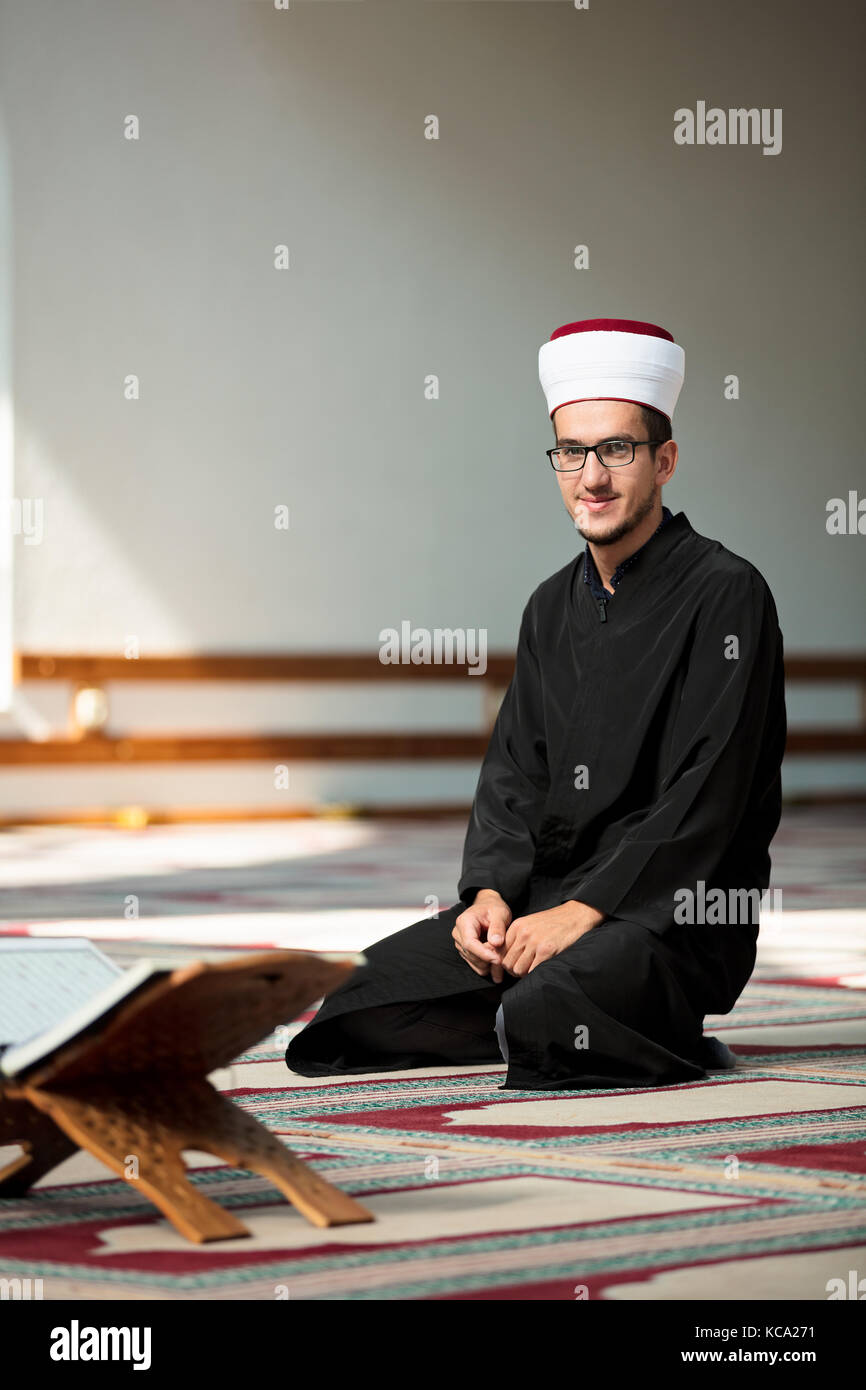 Religious muslim man praying inside the mosque Stock Photo - Alamy