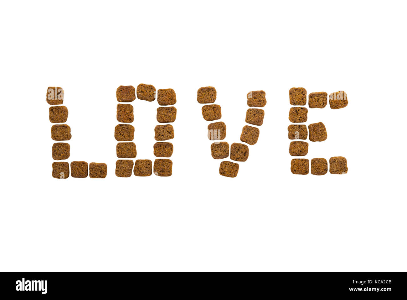 Love inscription lined with crackers on a white background Stock Photo ...