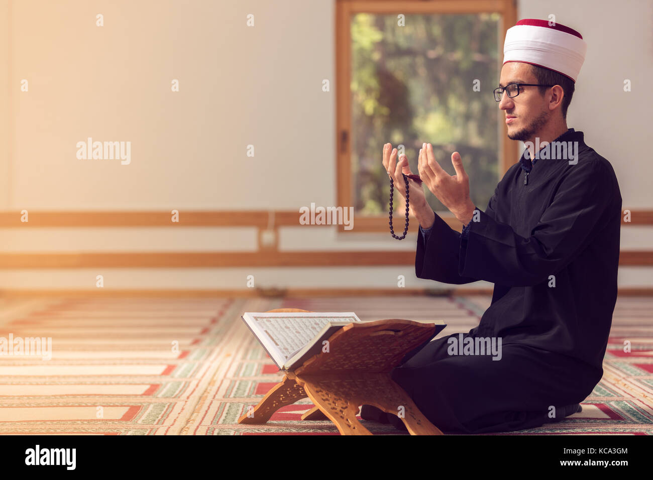 Religious muslim man praying inside the mosque Stock Photo - Alamy