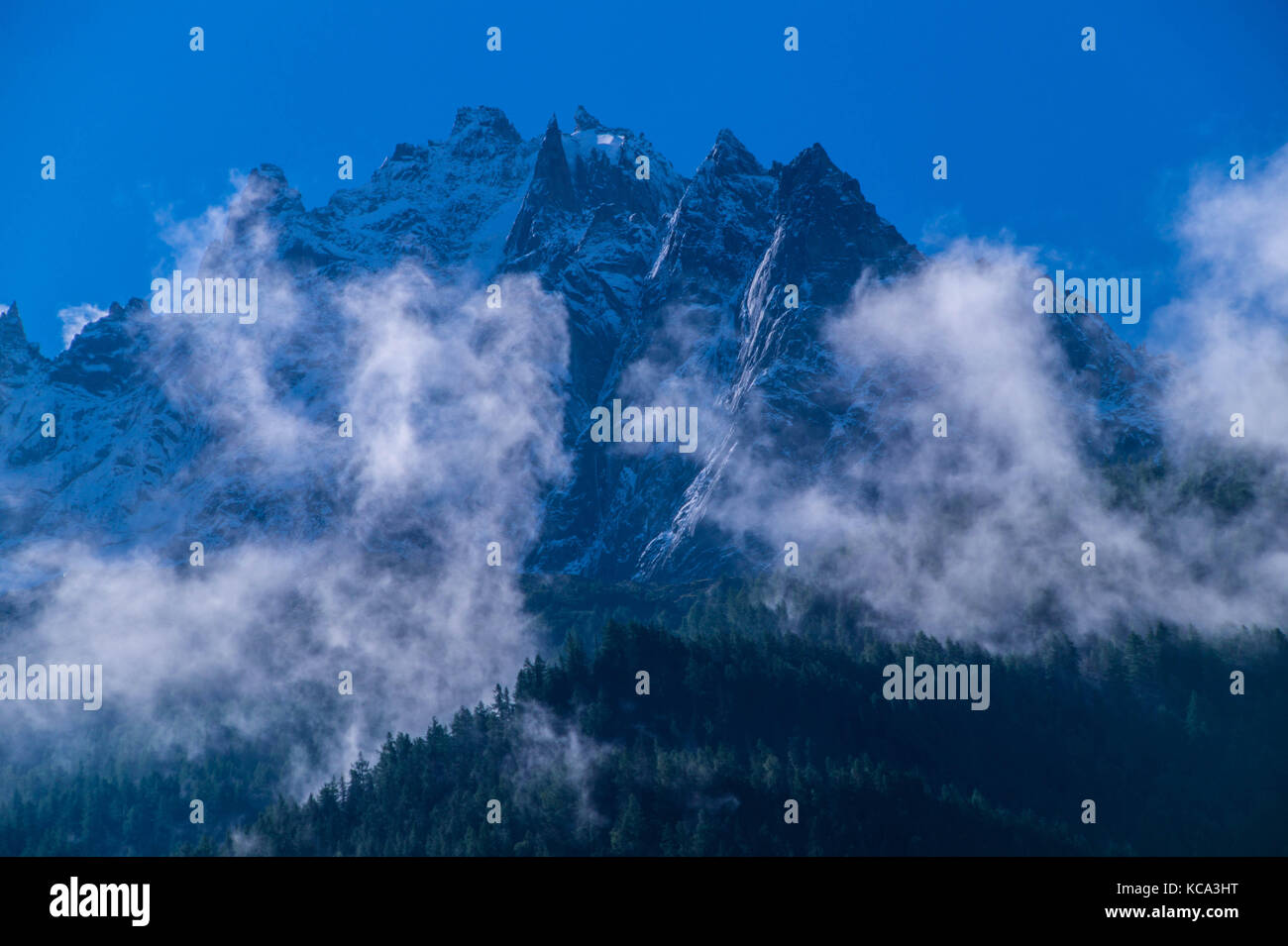 Chamonix needle with fog in the French Alps Stock Photo - Alamy