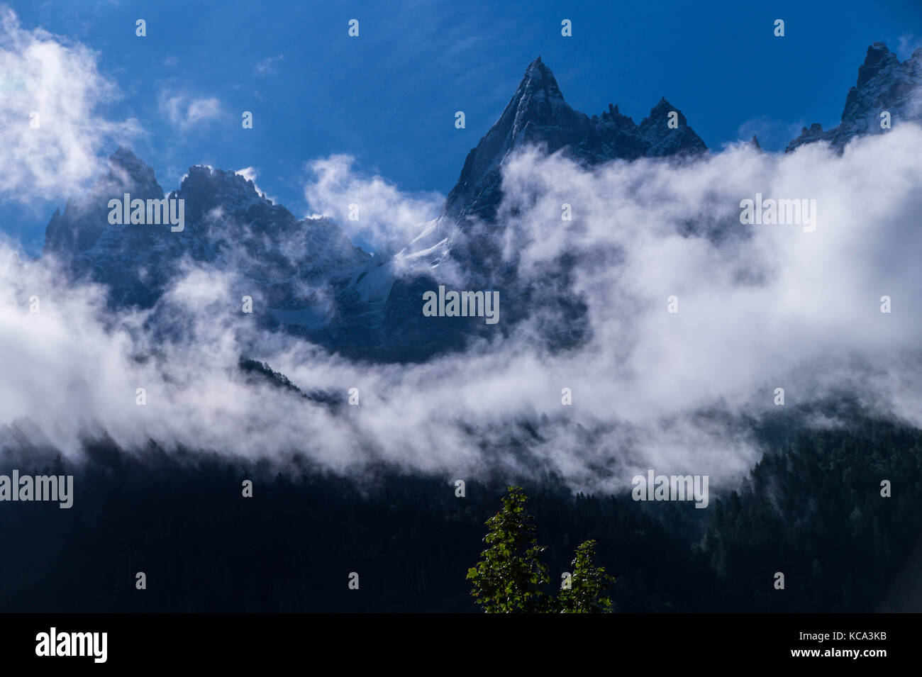 Chamonix needle with fog in the French Alps Stock Photo - Alamy