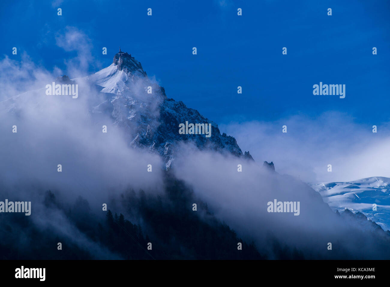 Chamonix needle with fog in the French Alps Stock Photo - Alamy