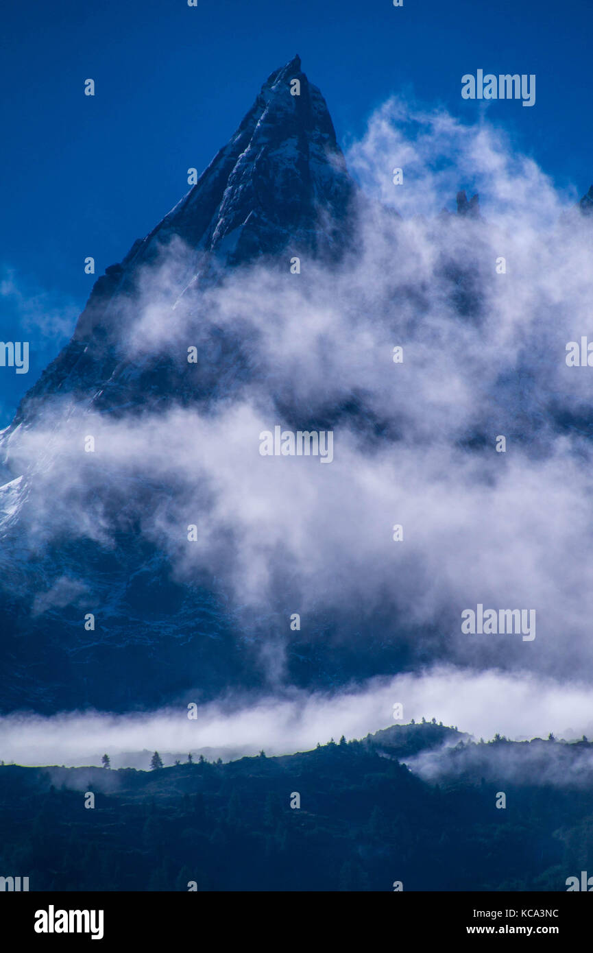 Chamonix needle with fog in the French Alps Stock Photo - Alamy
