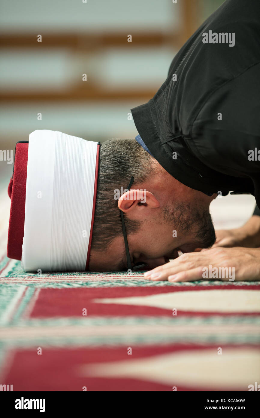 Young Imam praying inside of beautiful mosque Stock Photo - Alamy
