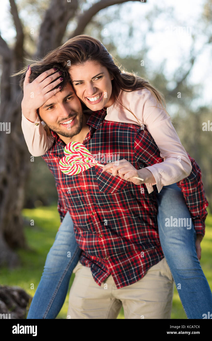 Portrait of a happy young couple in the nature hugged together Stock ...