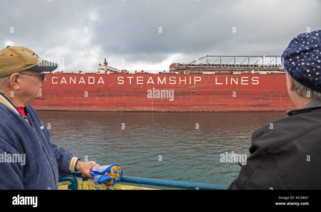 Sault Ste Marie, Michigan - Tourists on a boat tour of the Soo Locks ...