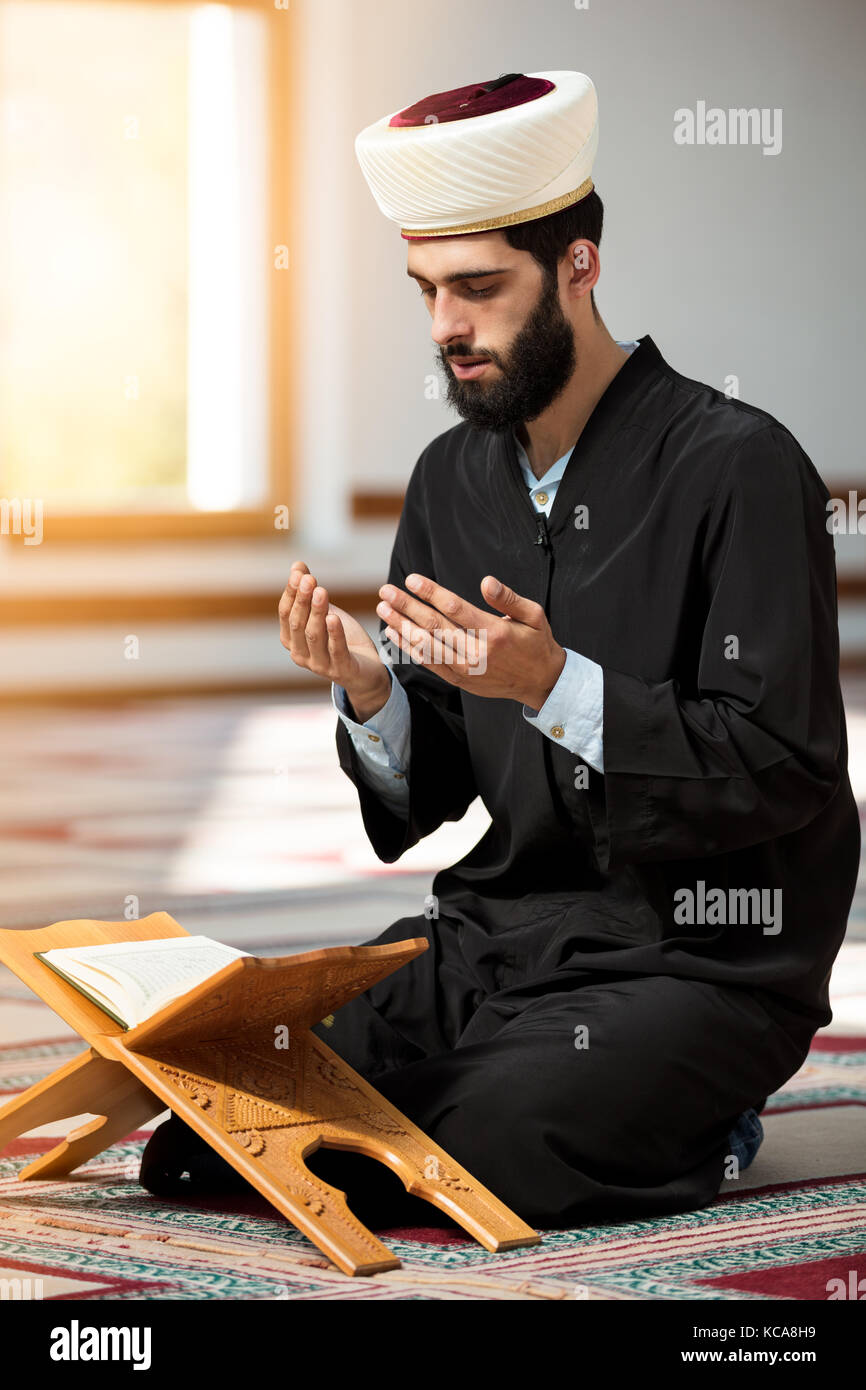 Religious muslim man praying inside the mosque Stock Photo - Alamy