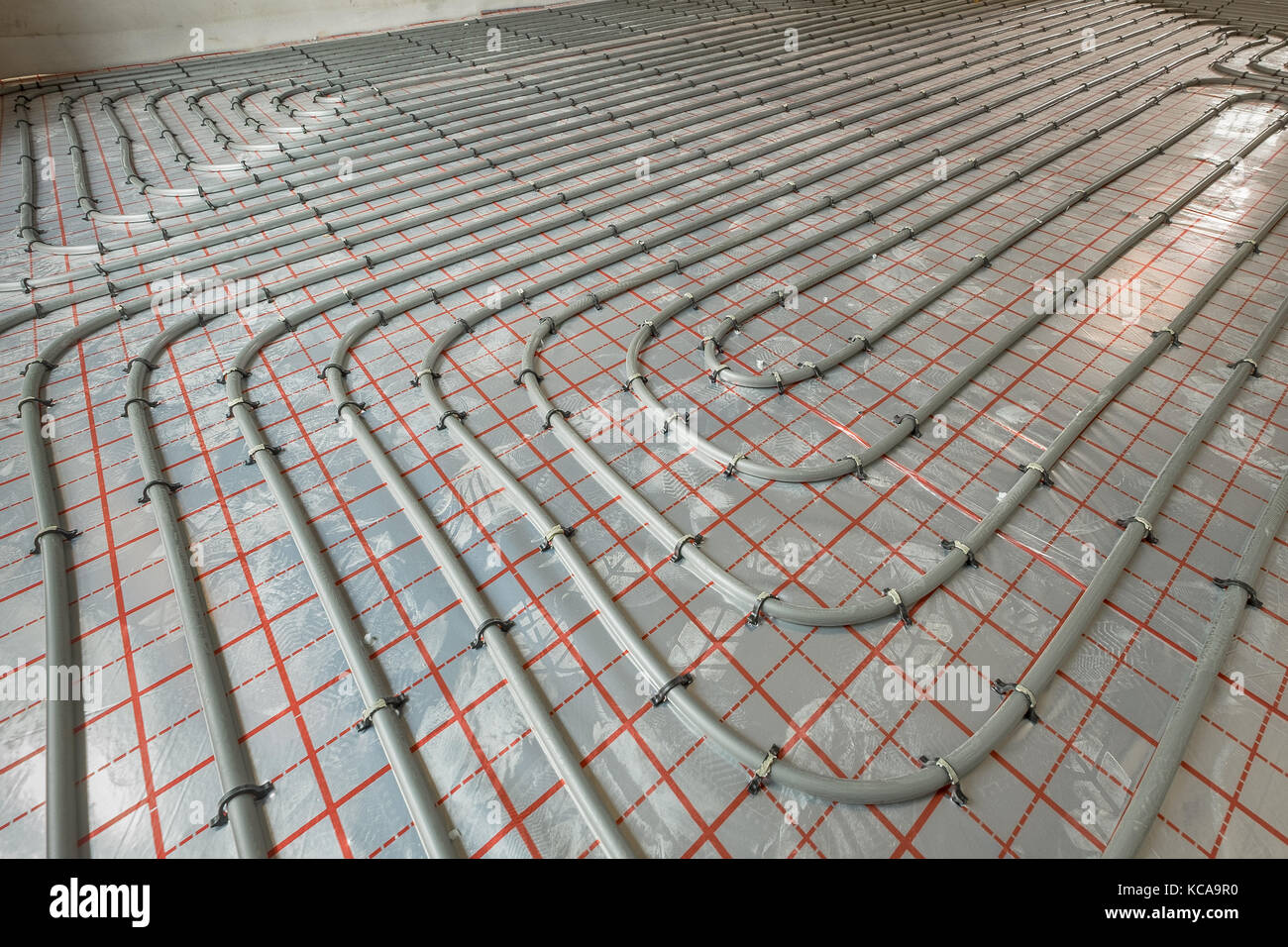 Warm floor. Home heating system installation Stock Photo - Alamy