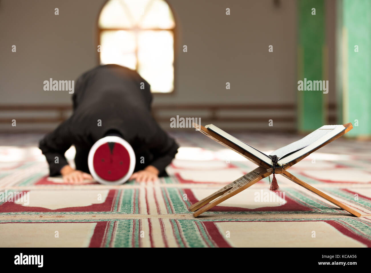 Young Imam praying inside of beautiful mosque Stock Photo - Alamy