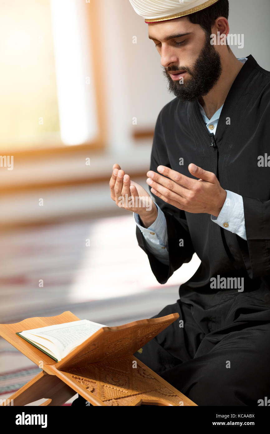 Religious muslim man praying inside the mosque Stock Photo - Alamy