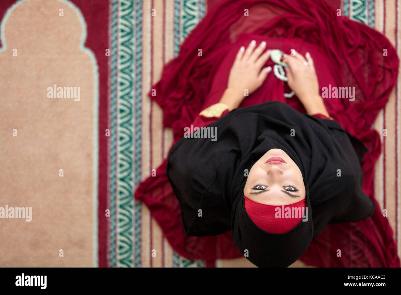 Top aerial view Young beautiful Muslim Woman Praying In Mosque Stock ...