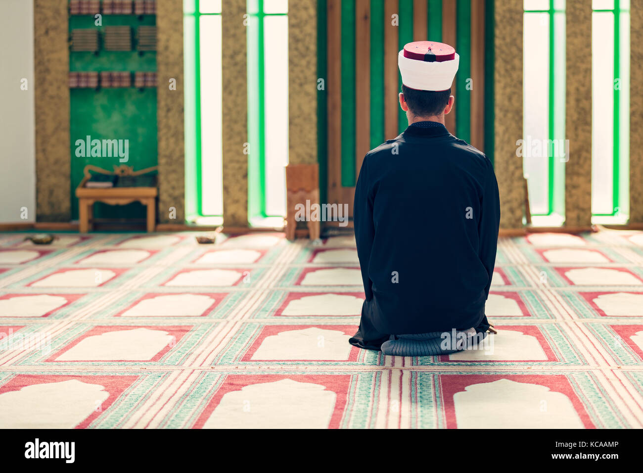 Religious muslim man praying inside the mosque Stock Photo - Alamy