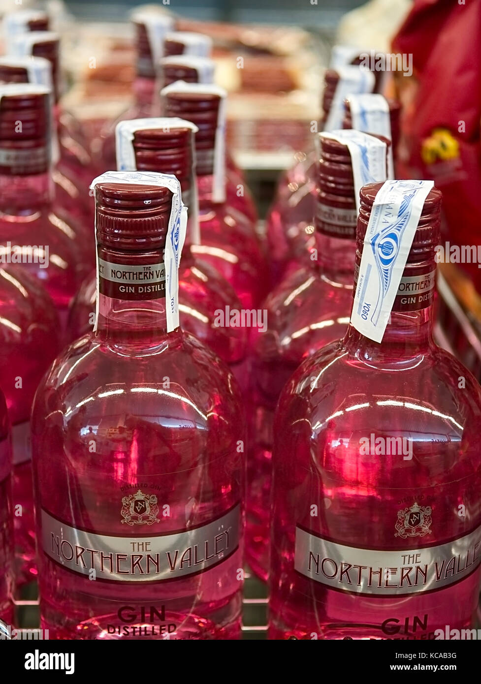 Bottles of Pink Gins displayed in rows Stock Photo - Alamy