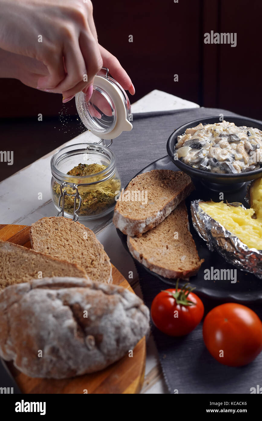 Preparation of potatoes with mushrooms and vegetables Stock Photo - Alamy