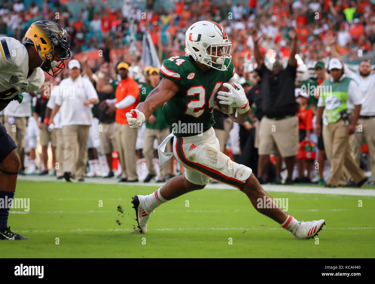 Miami Gardens, Florida, USA. 23rd Sep, 2017. Miami Hurricanes running ...