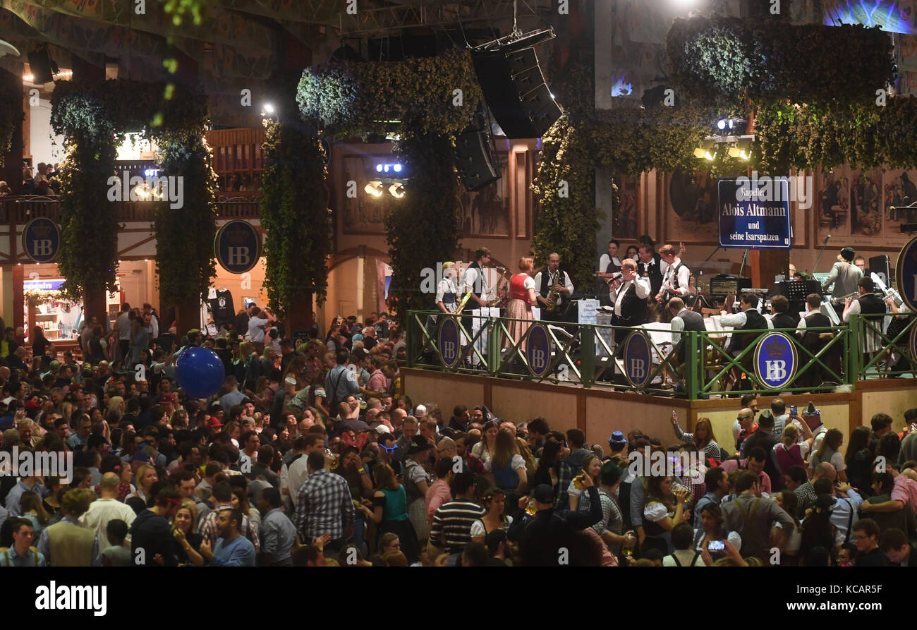 Guests celebrate at the end of this year's Oktoberfest in the Hofbraeu ...