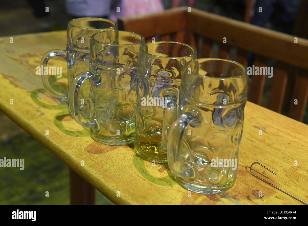 Empty beer mugs on a tables after the finale on the last day of ...