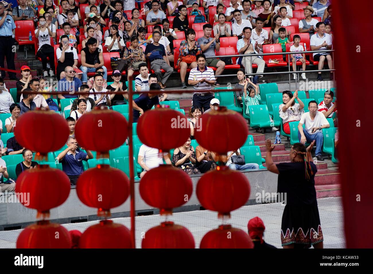 Shenzhen. 4th Oct, 2017. Visitors watch performances at a theme park in ...